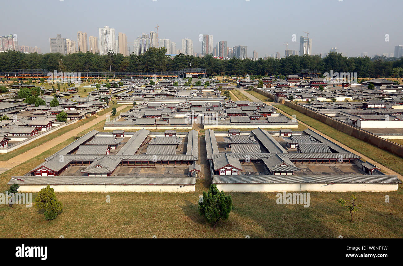 A Chinese worker repairs part of a miniature replica of the Tang ...