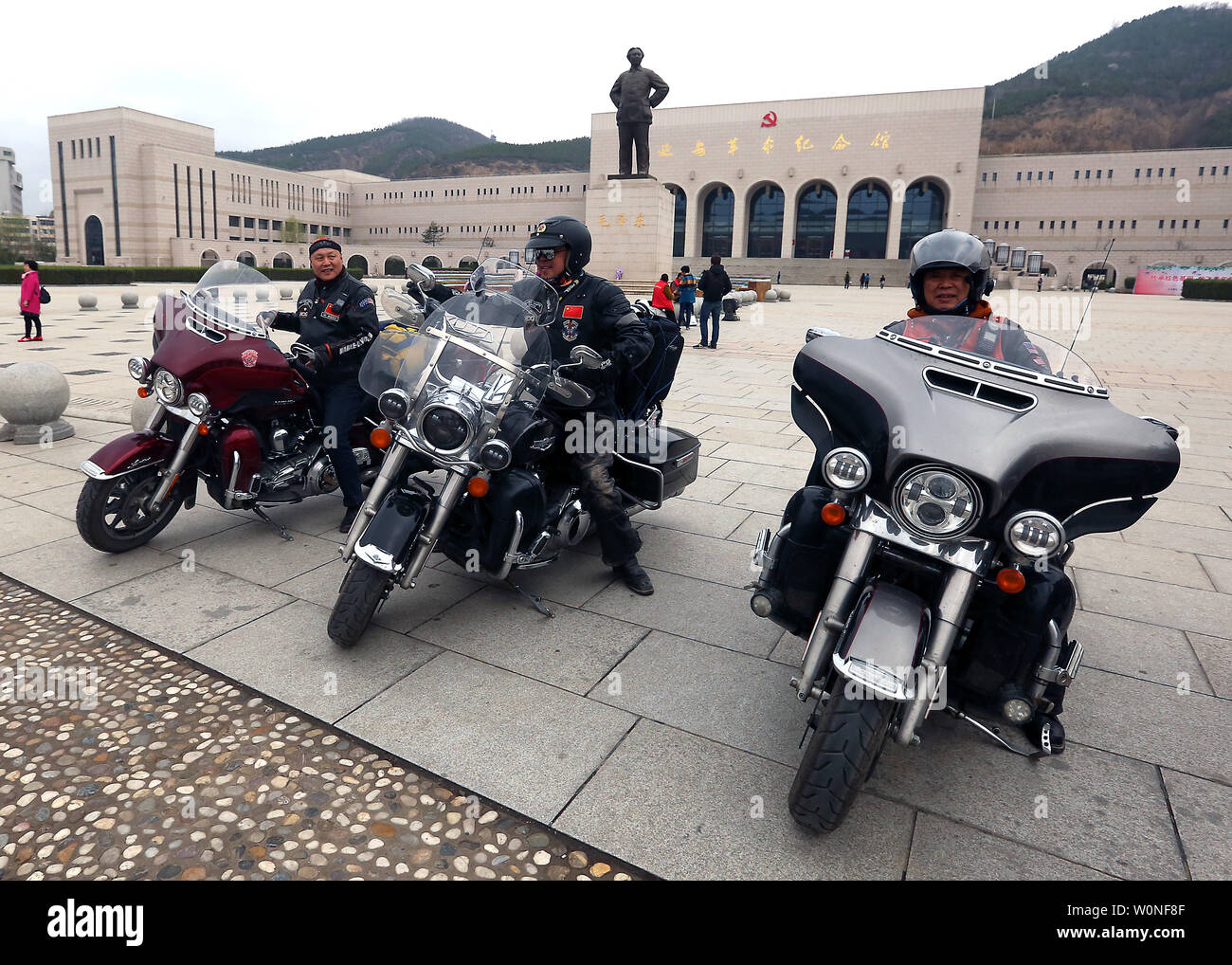 Chinese bikers arrive on the square of the Revolution Museum, featuring ...