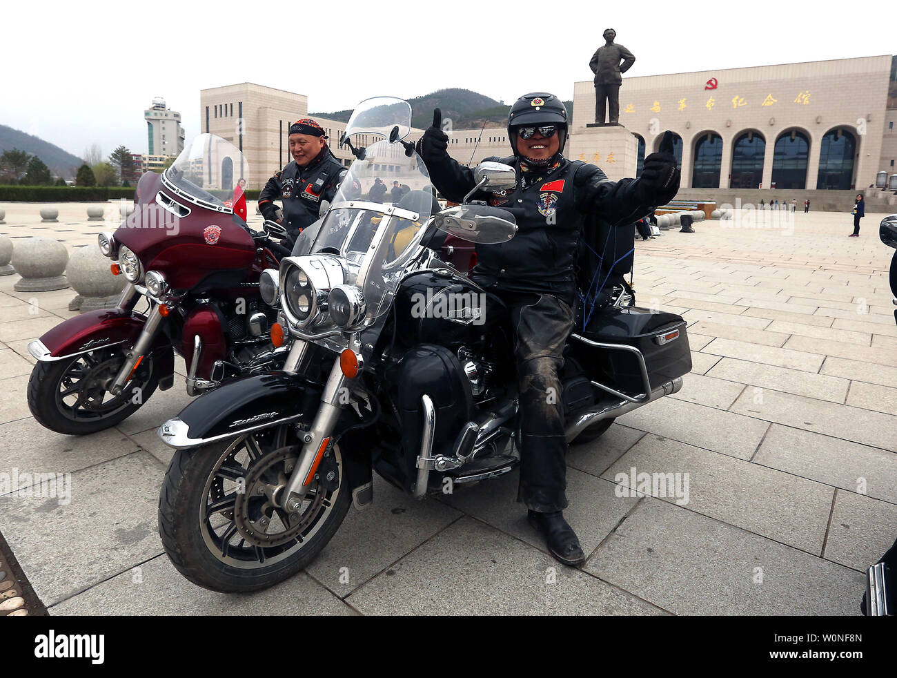 Chinese bikers arrive on the square of the Revolution Museum, featuring ...