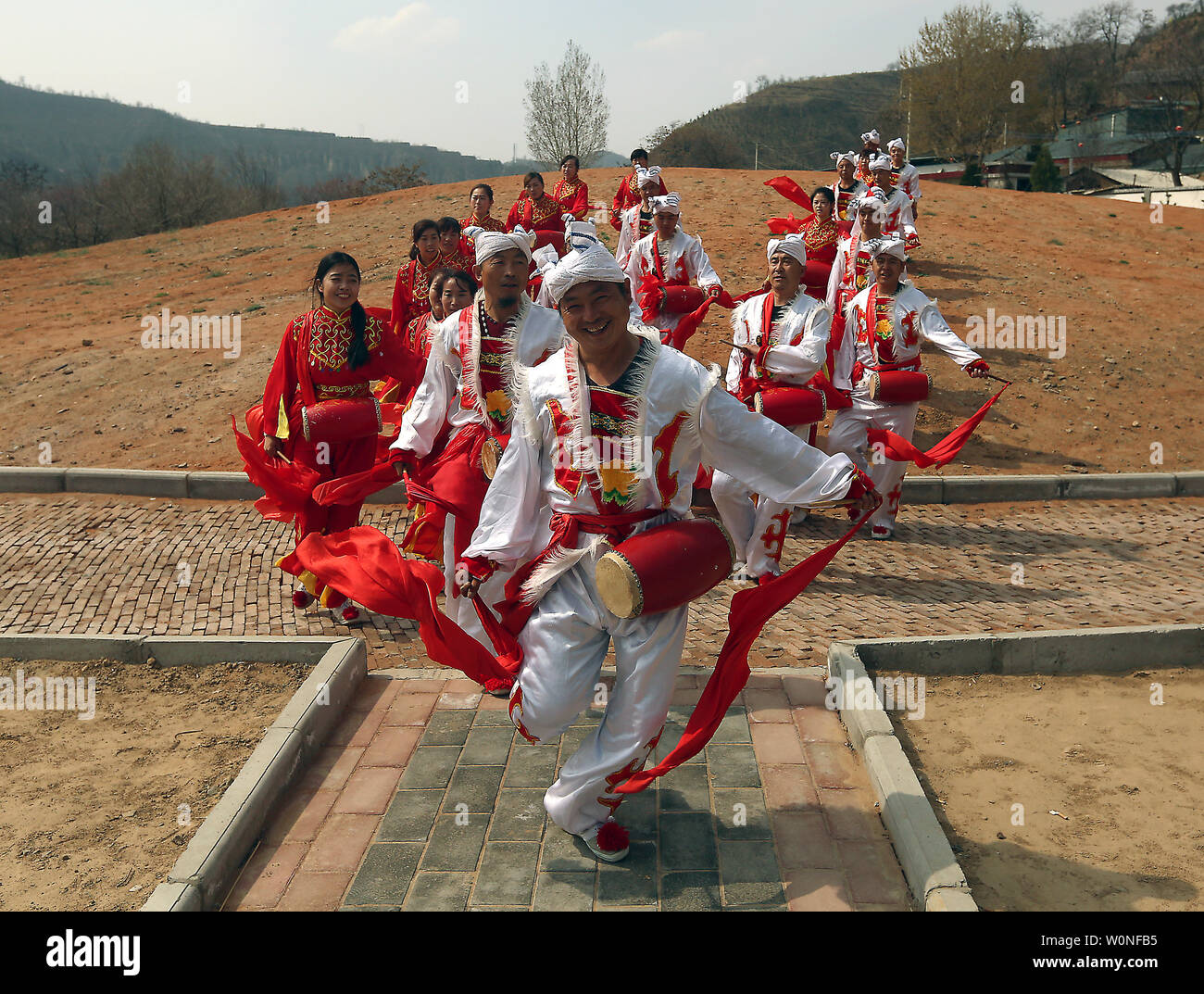 Chinese from surrounding villages perform the famous Ansai Waist Drum ...