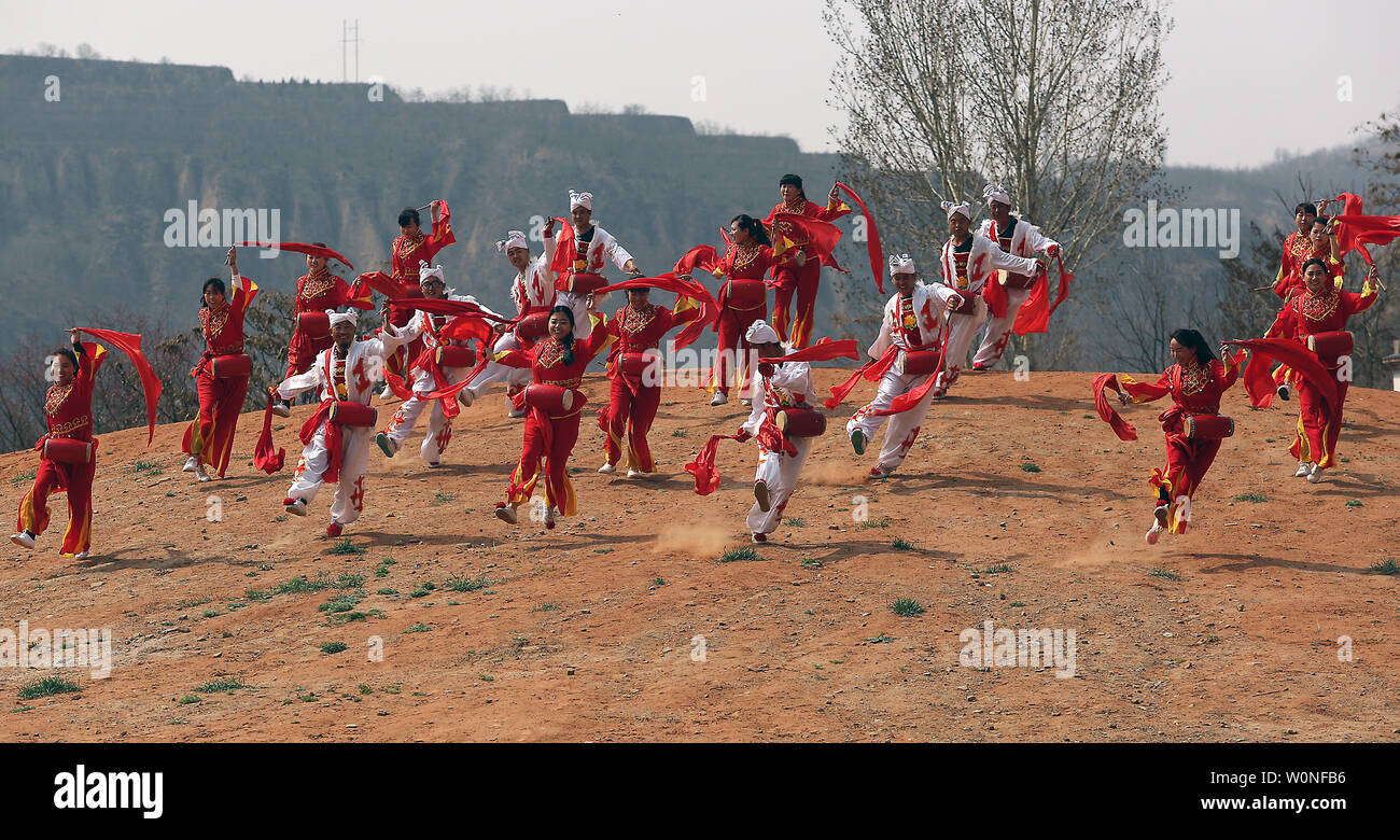 Chinese from surrounding villages perform the famous Ansai Waist Drum ...