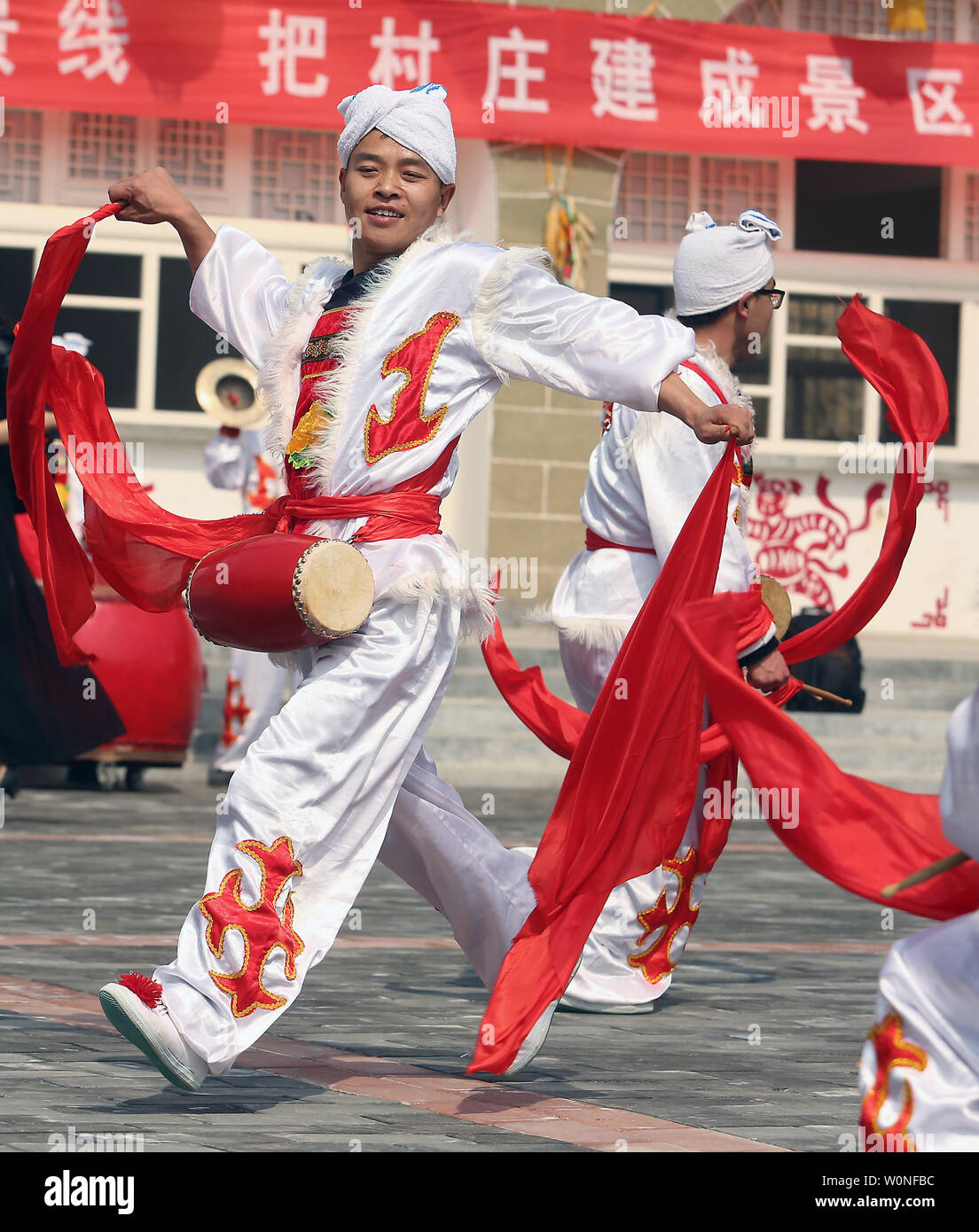 Chinese from surrounding villages perform the famous Ansai Waist Drum ...