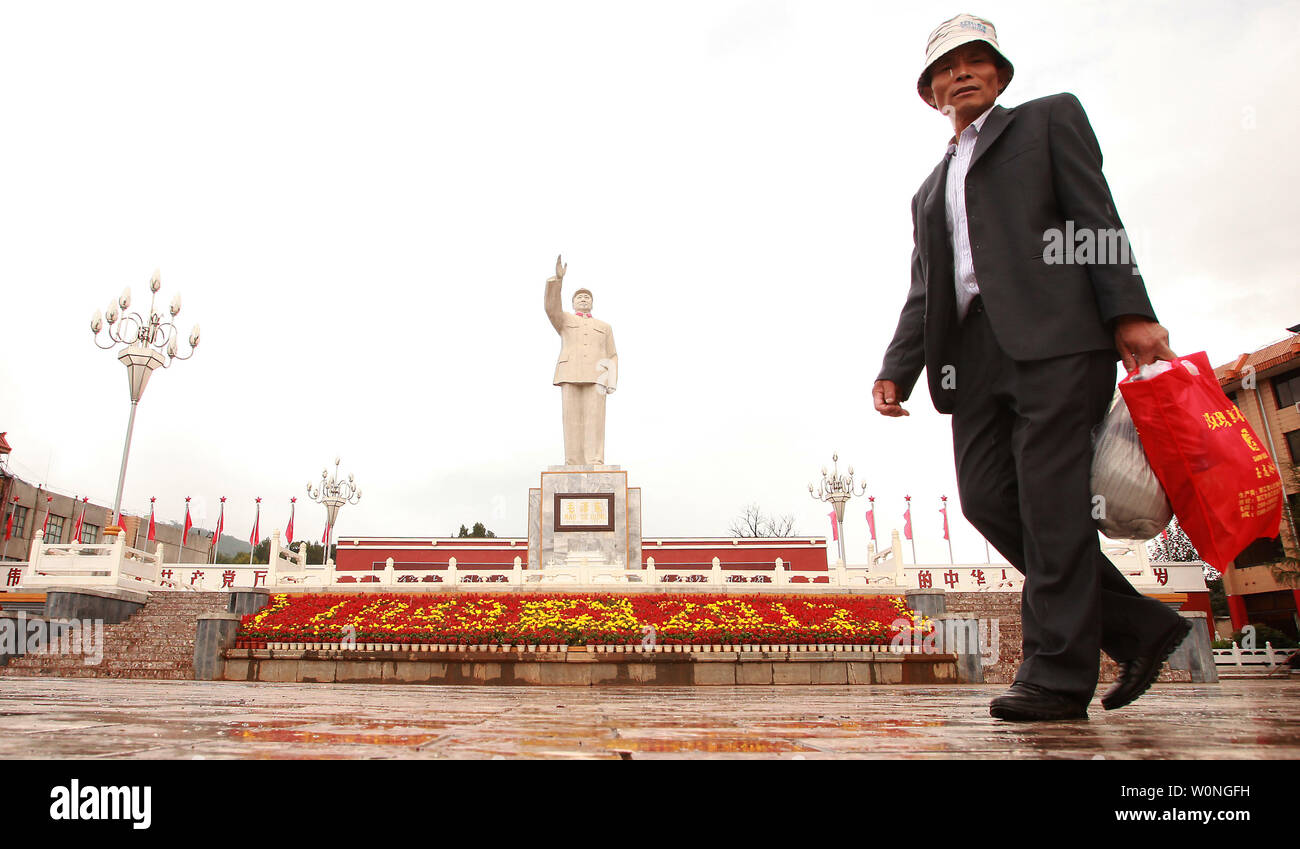 Chinese tourists take pictures in front of one of the few remaining ...
