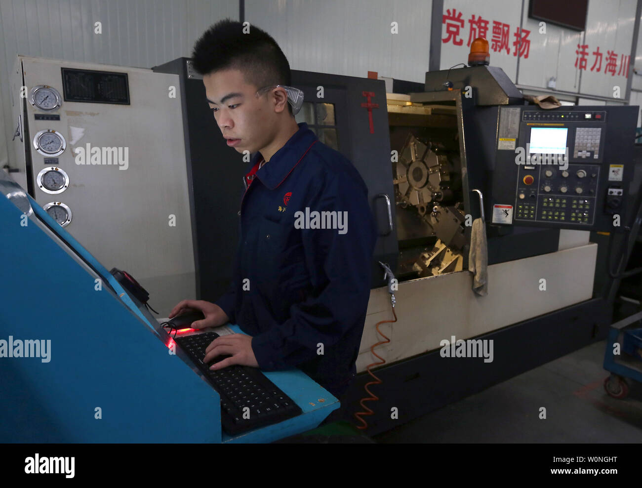 A Chinese engineer monitors the precise drilling of aviation gas ...