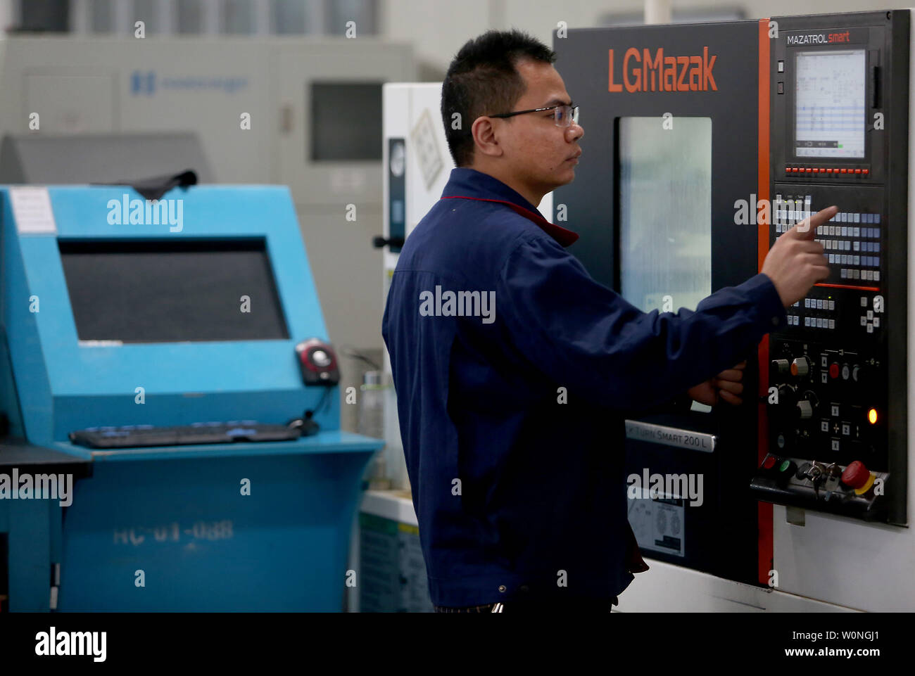 A Chinese engineer monitors the precise drilling of aviation gas ...