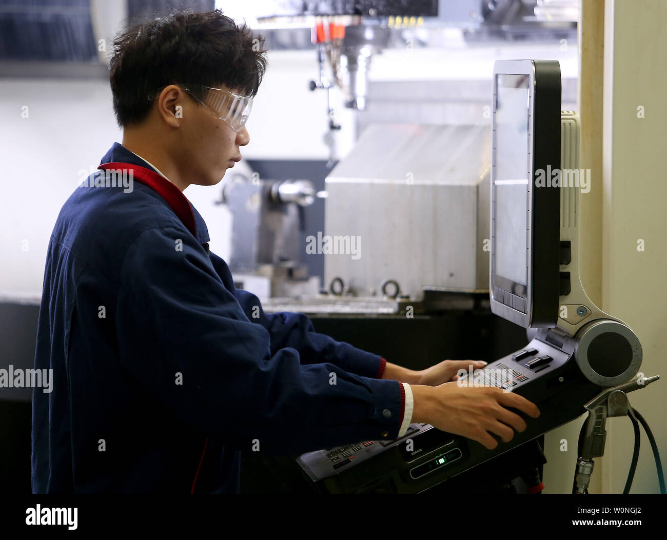 A Chinese engineer monitors the precise drilling of aviation gas ...
