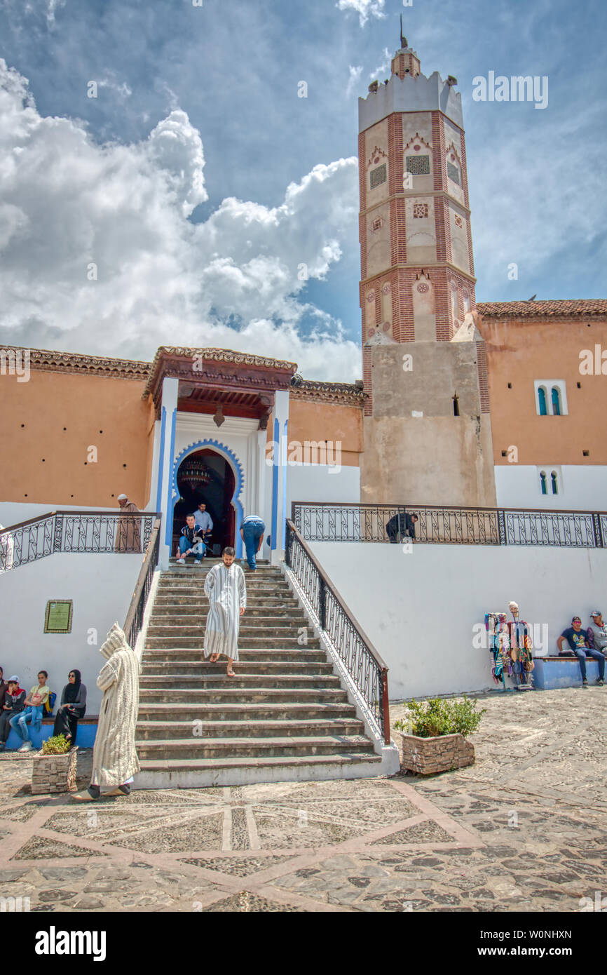 Chefchaouen, Morocco - May 03, 2019: Several Muslim men leaving the ...