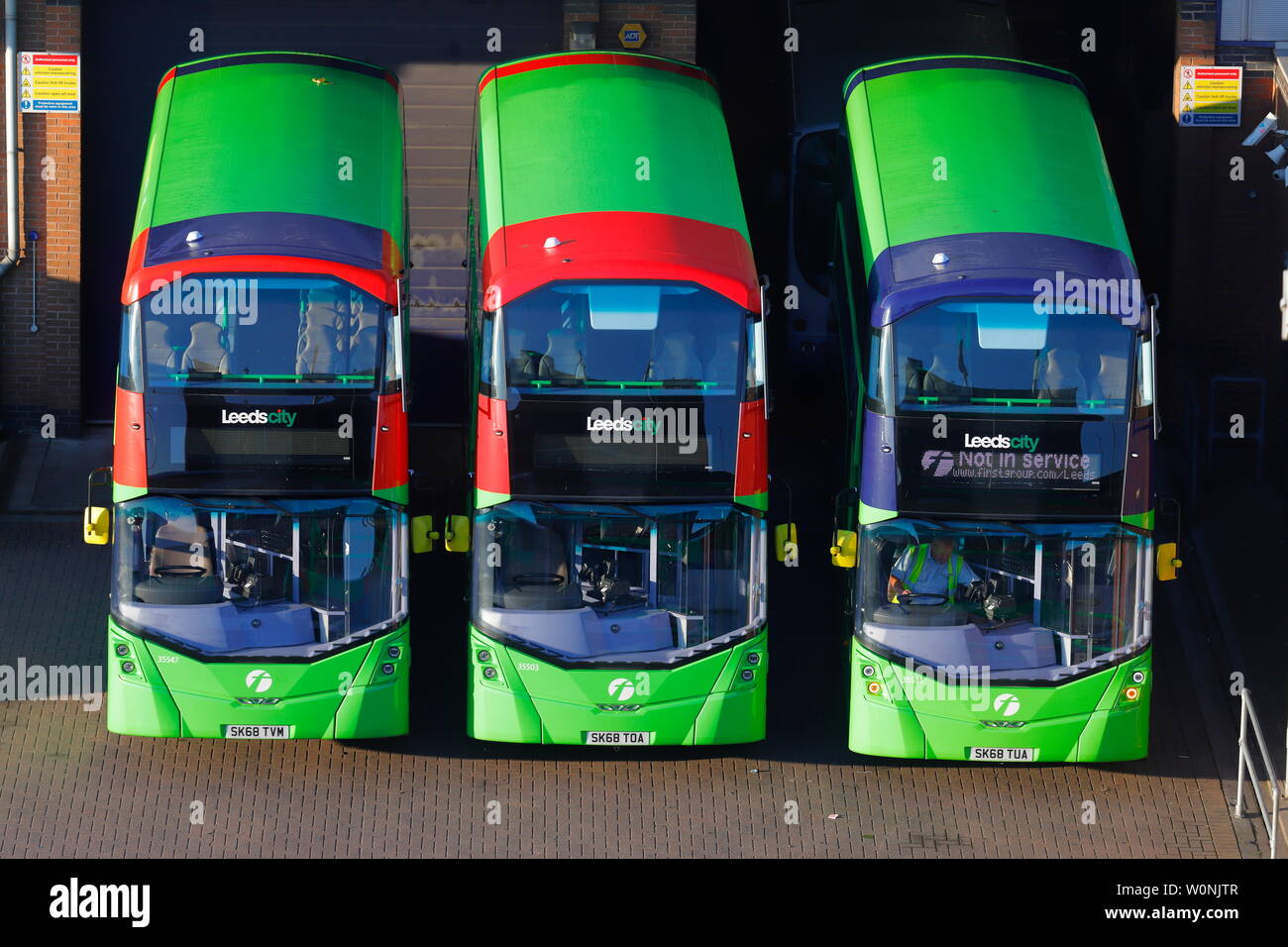 Hybrid double decker buses parked side by side in First Bus Depot in ...