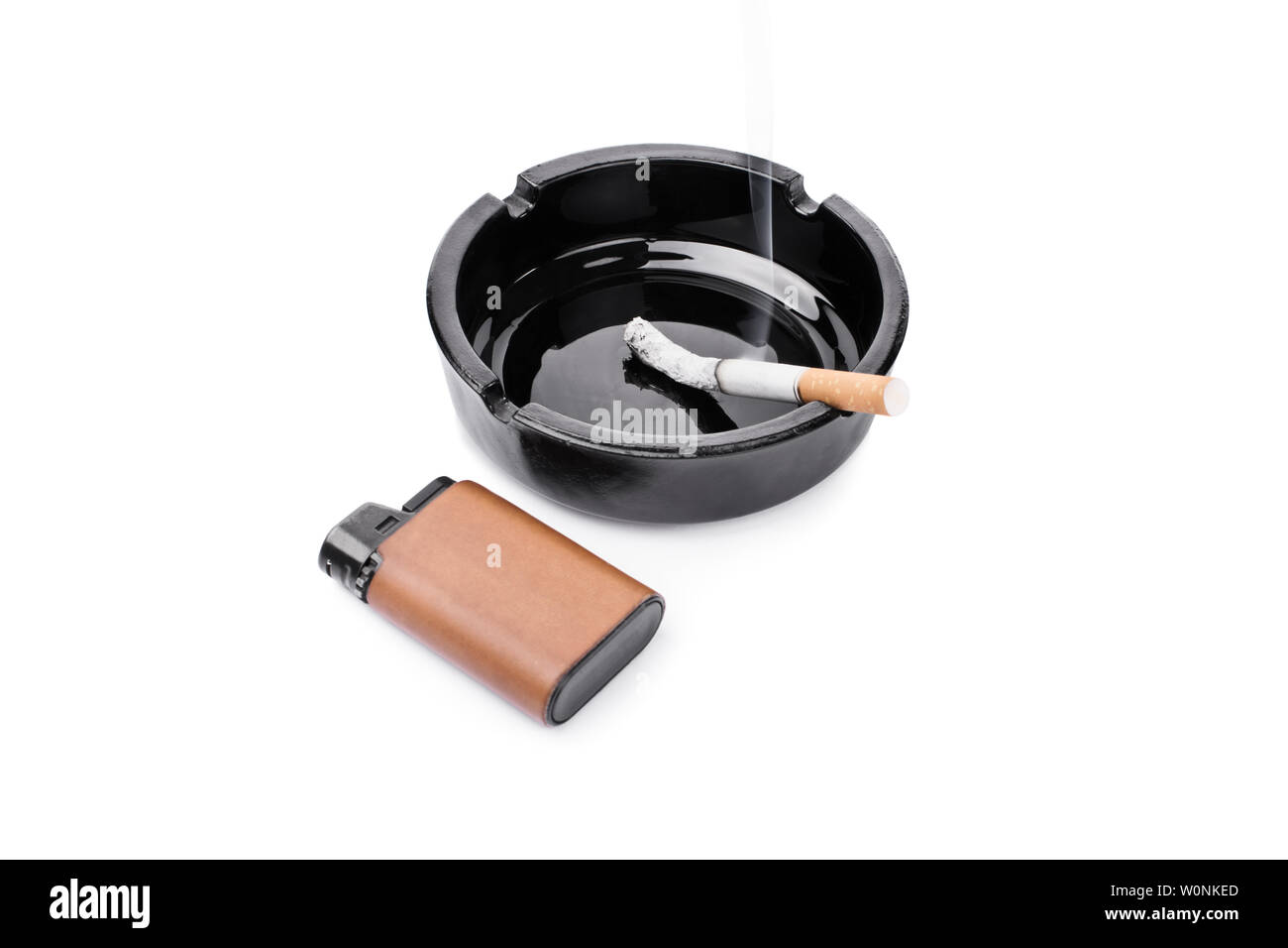 Ashtray, lighter and a smoking cigarette, isolated on white background ...