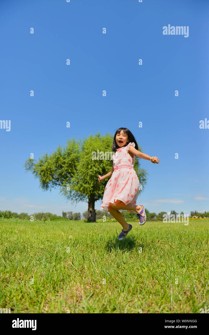 Little girl jumping Stock Photo - Alamy