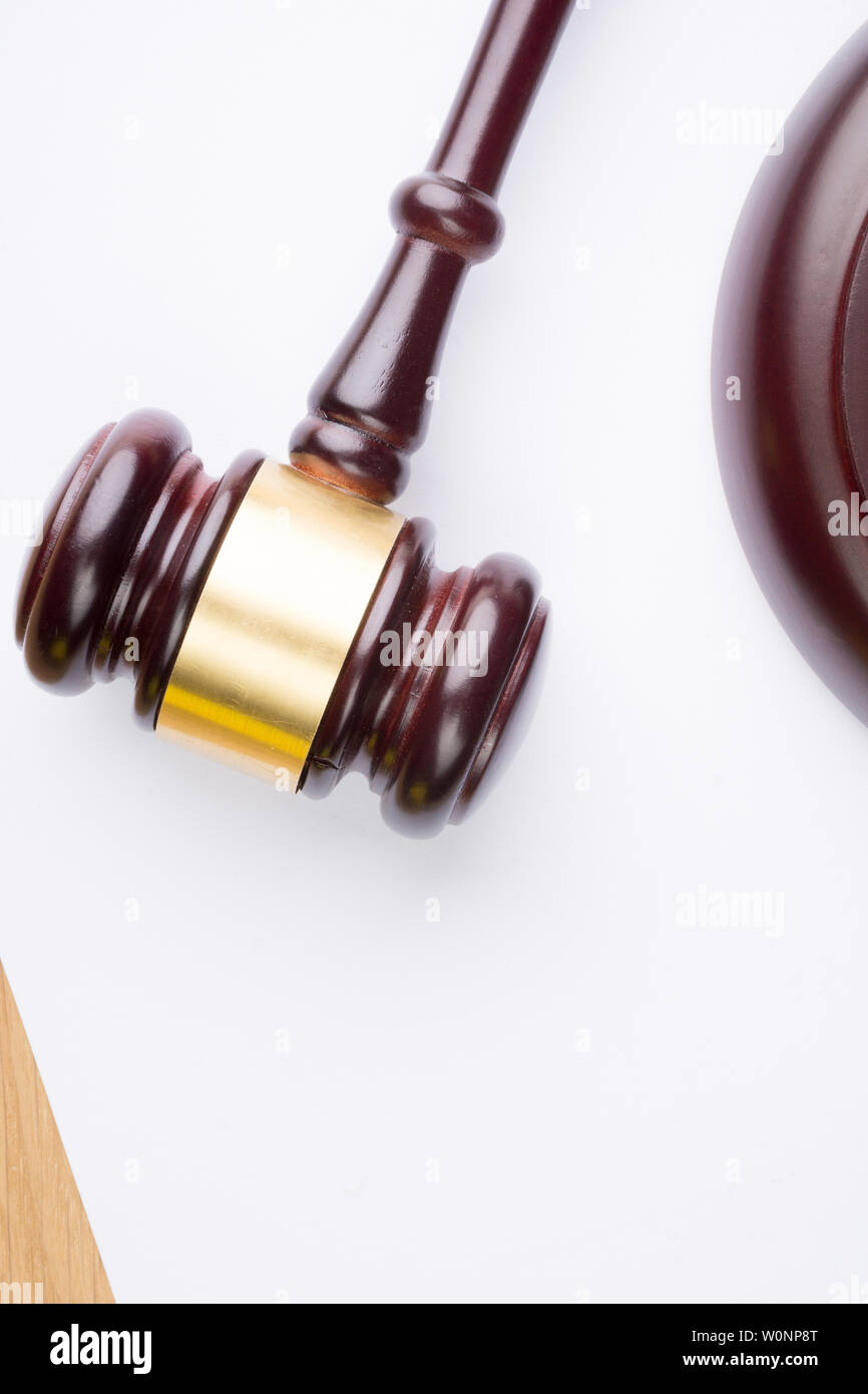 Judge hammer on white paper and table Stock Photo - Alamy