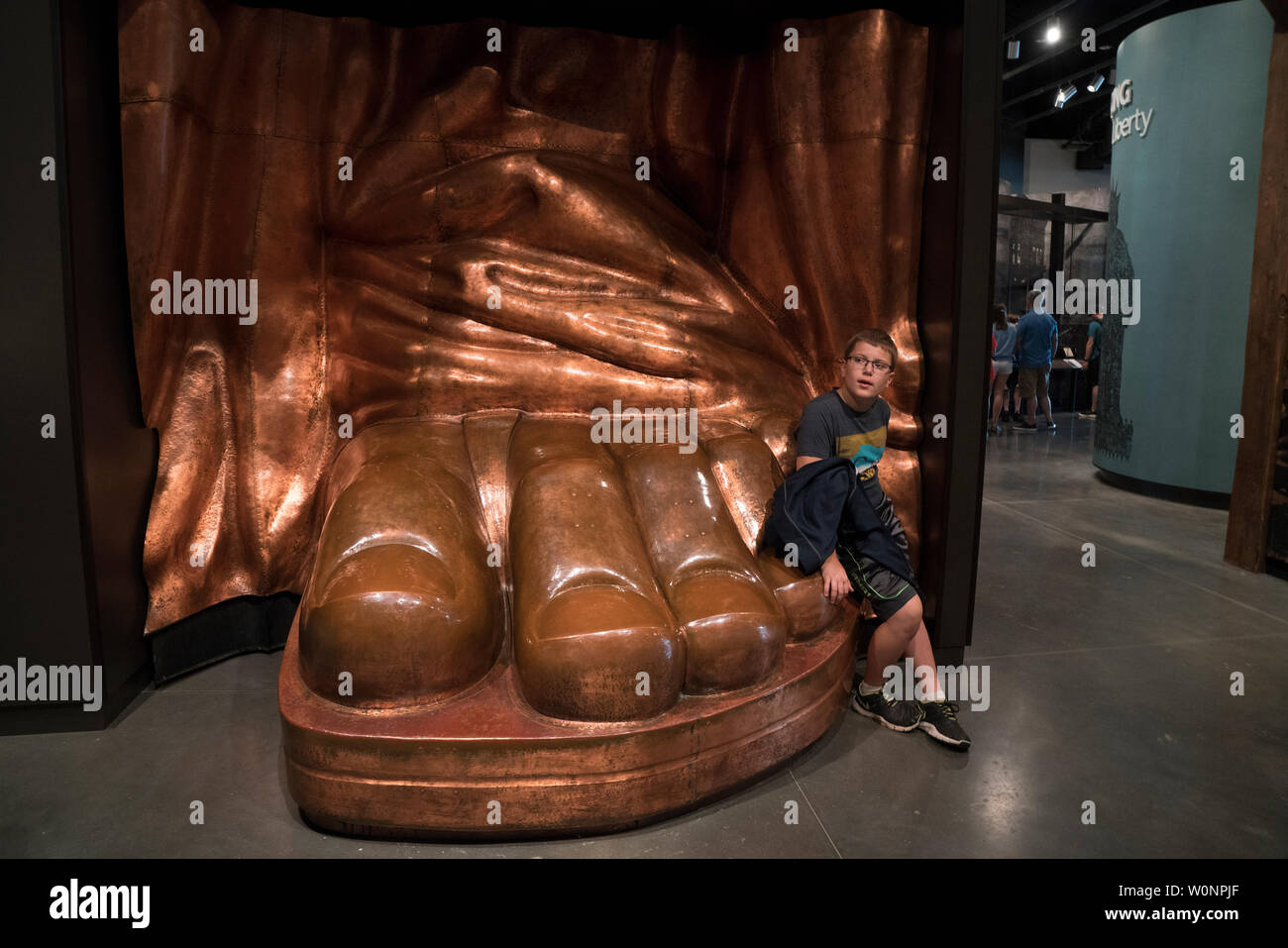 Visitors often pose for photos atop a replica of the Statue of Liberty ...