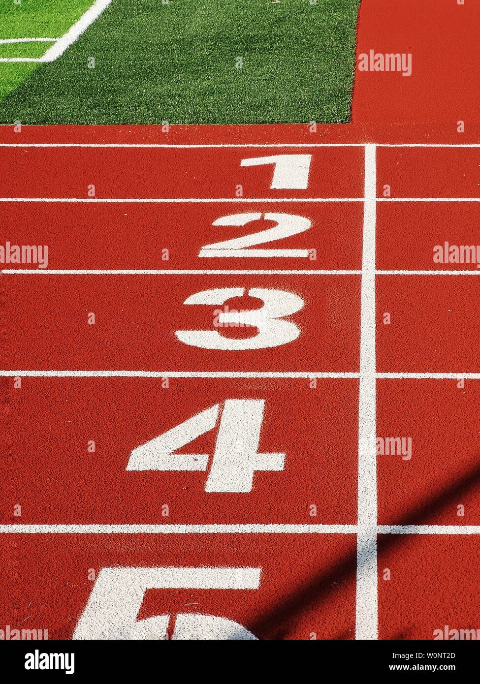 Track and field runway starting line Stock Photo - Alamy