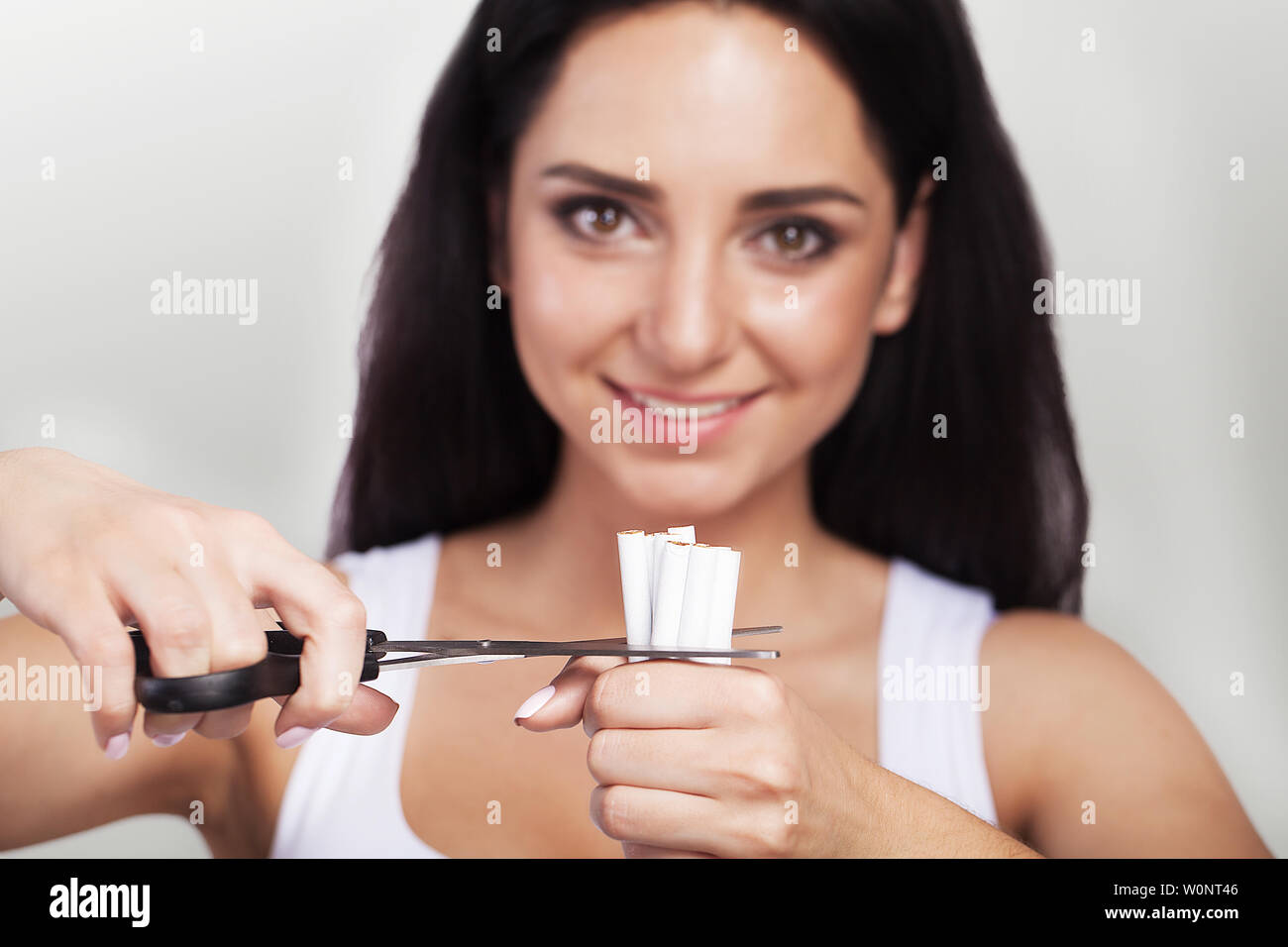 Woman breaking cigarette hands hi-res stock photography and images - Alamy