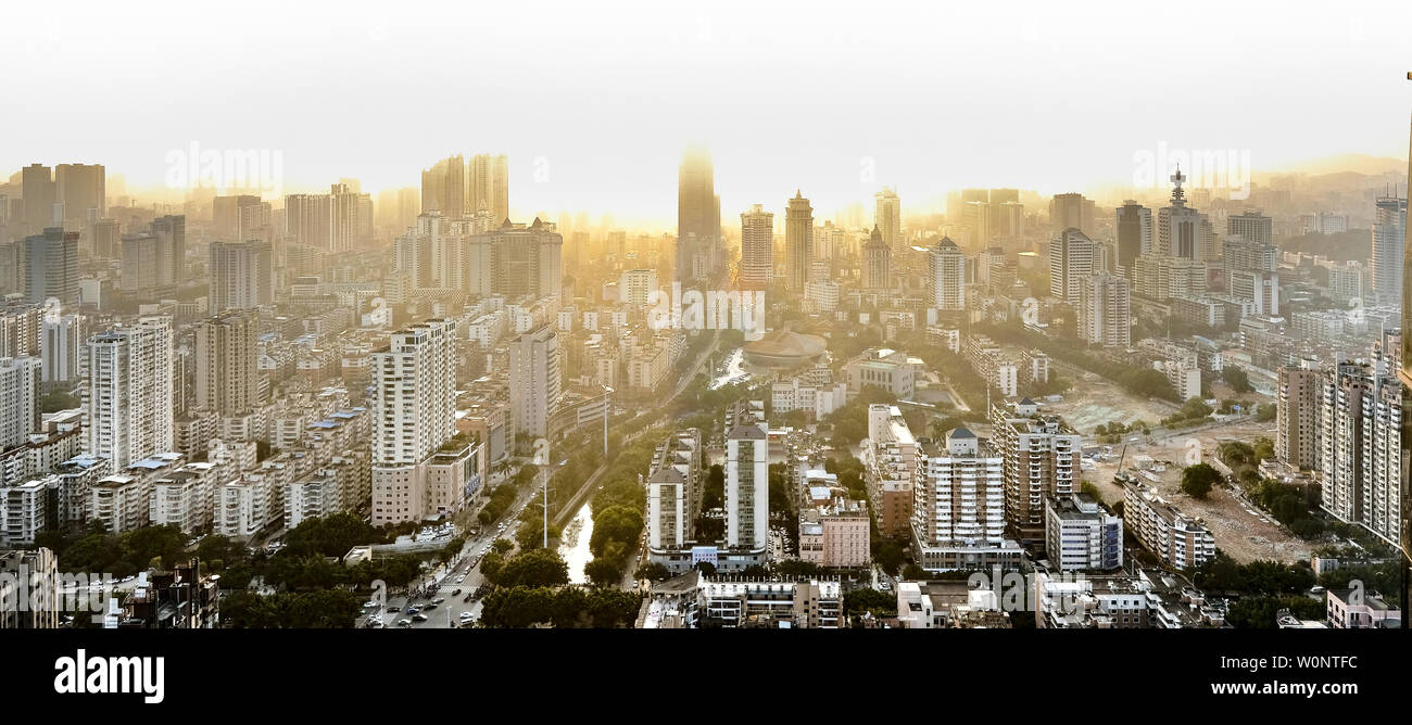 The sunset city of high-rise building Stock Photo - Alamy