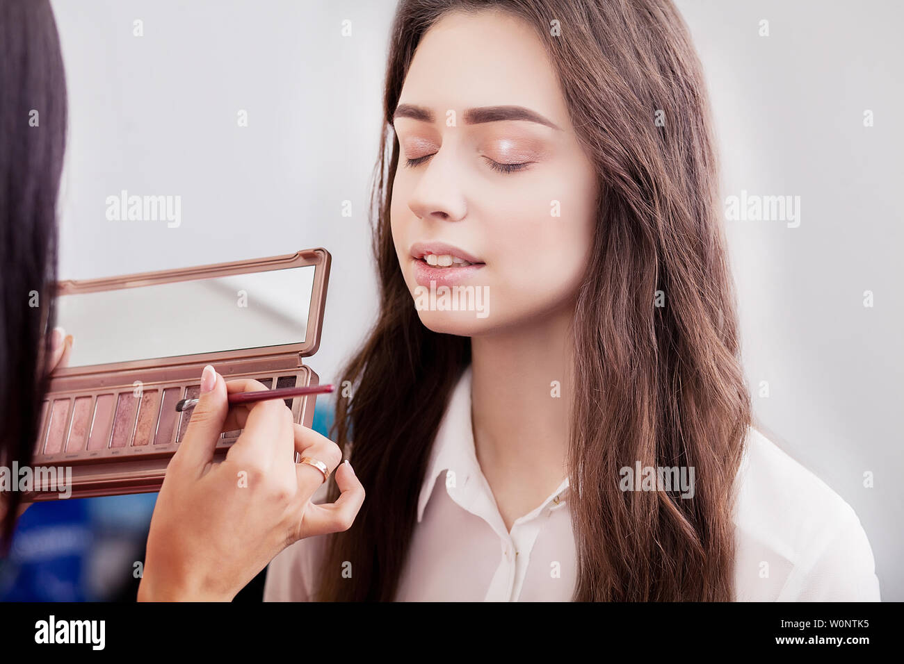 Mixed race woman applying face hi-res stock photography and images - Alamy