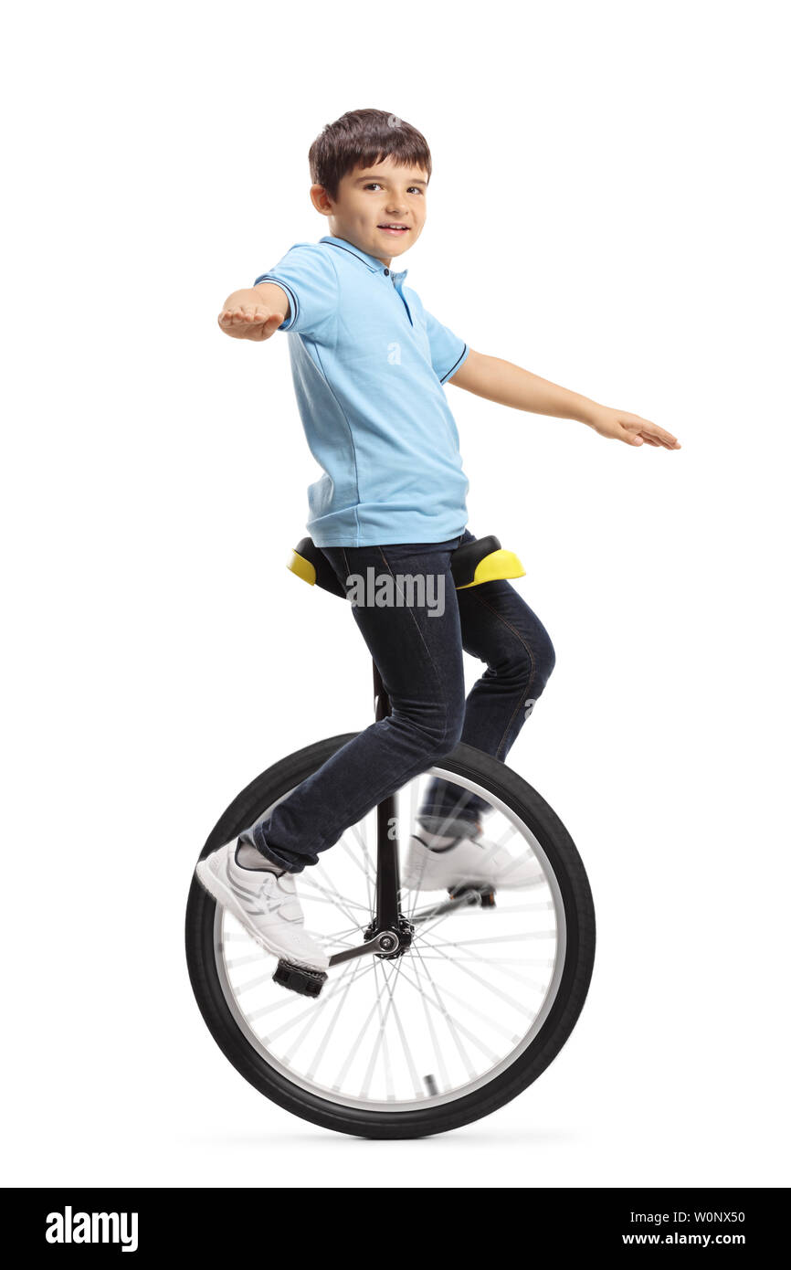Boy riding unicycle Cut Out Stock Images & Pictures - Alamy