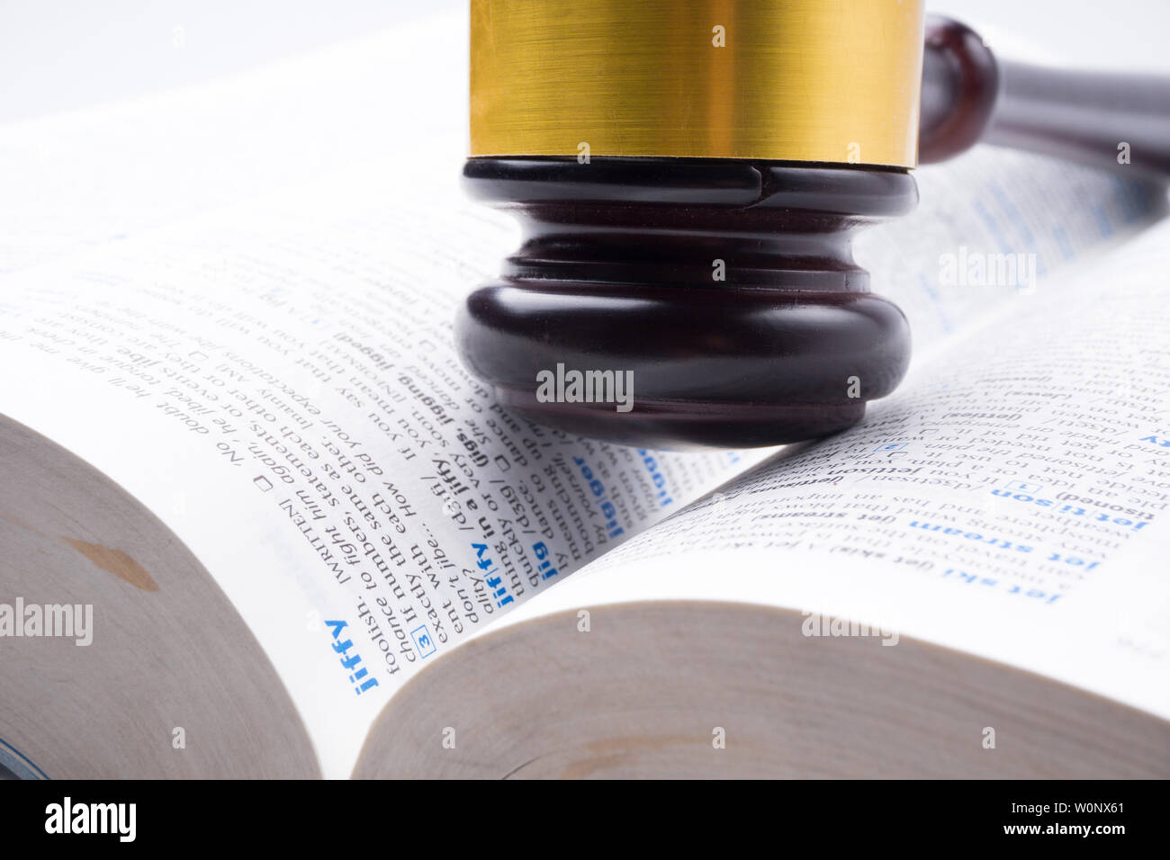 Judge hammer lay on book Stock Photo - Alamy
