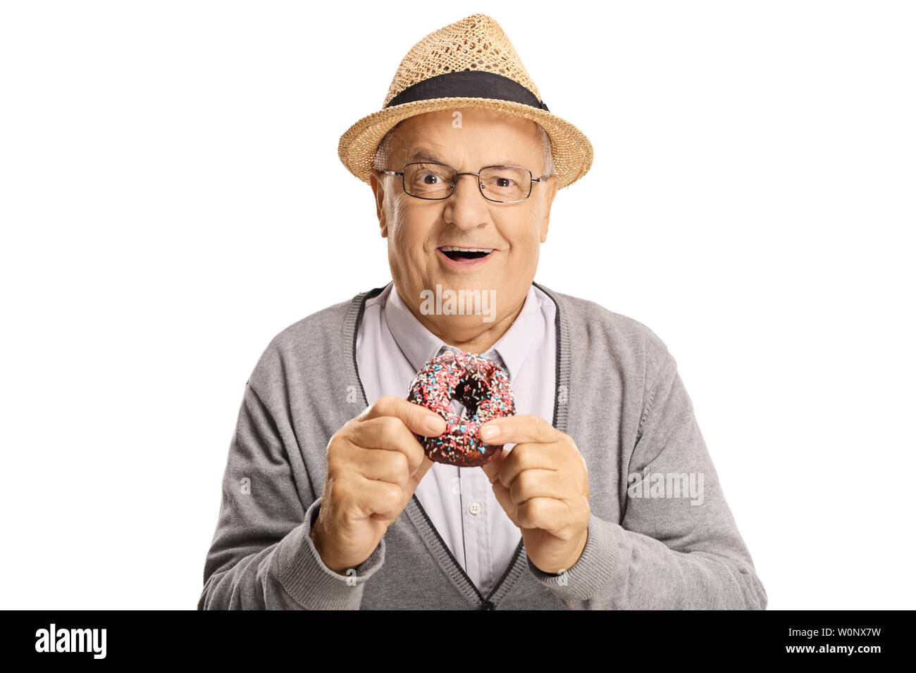 Cheerful senior man eating a donut isolated on white background Stock ...