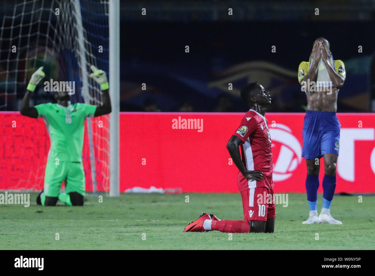 Cairo, Egypt. 27th June, 2019. Kenya and Tanzania players react after the final whistle of the ...