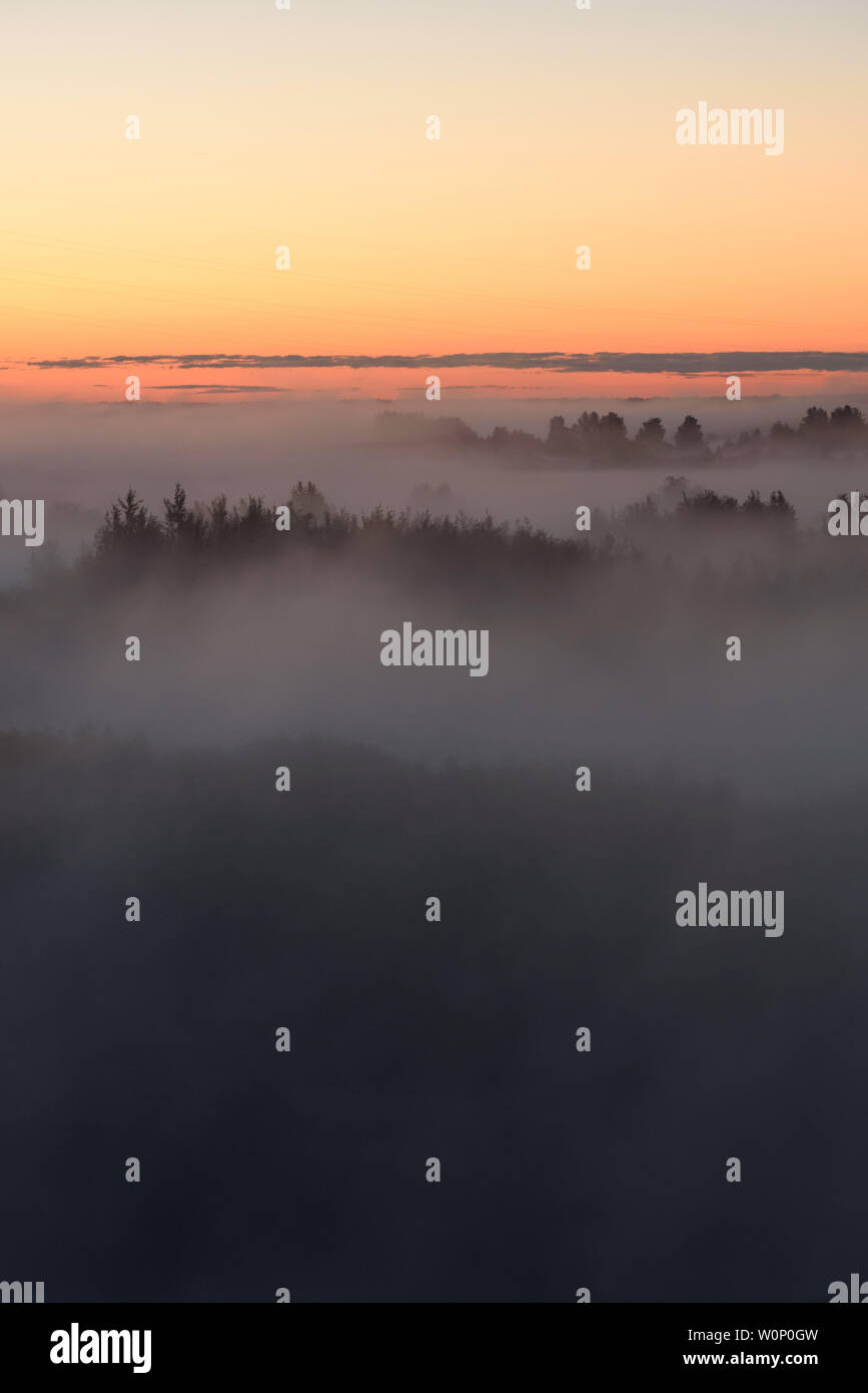Midnight fog covers the fields and the river and the power lines Stock ...