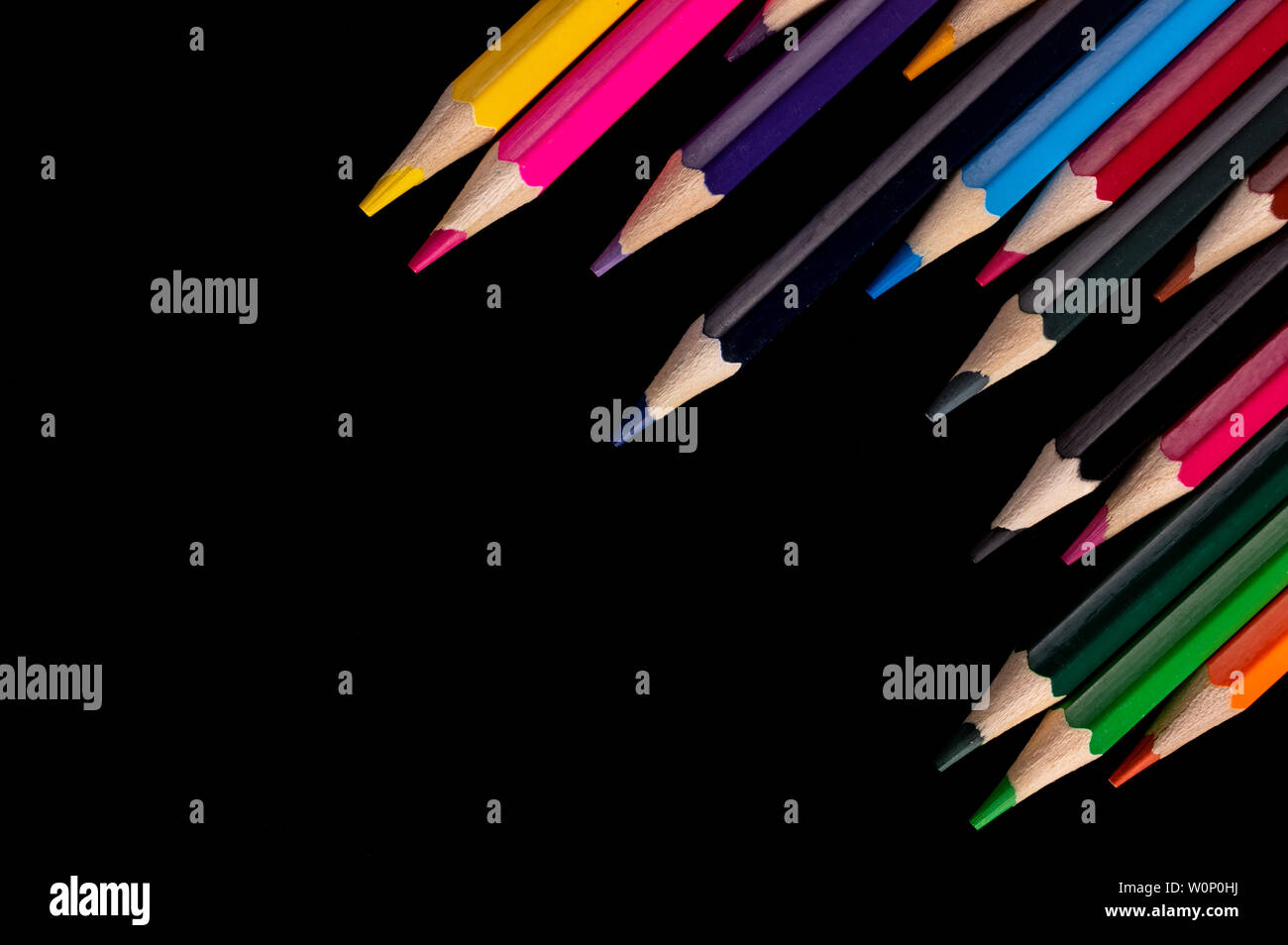 Colored pencil close-up on a black background Stock Photo - Alamy