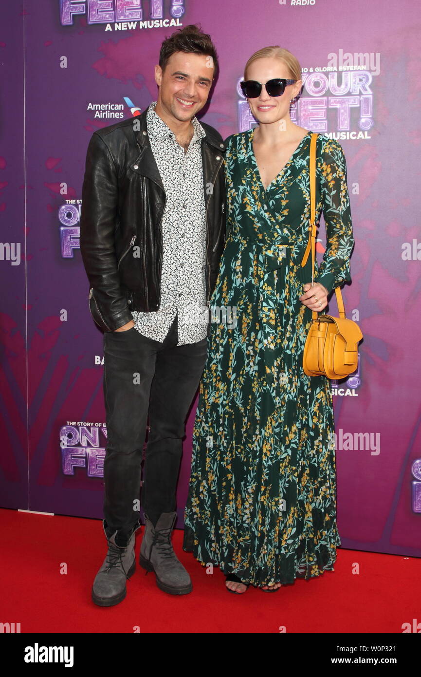 Ben Adams and guest arrive on the red carpet during the On Your Feet ...