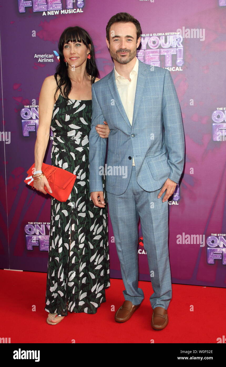 Joe McFadden and guest arrive on the red carpet during the On Your Feet ...