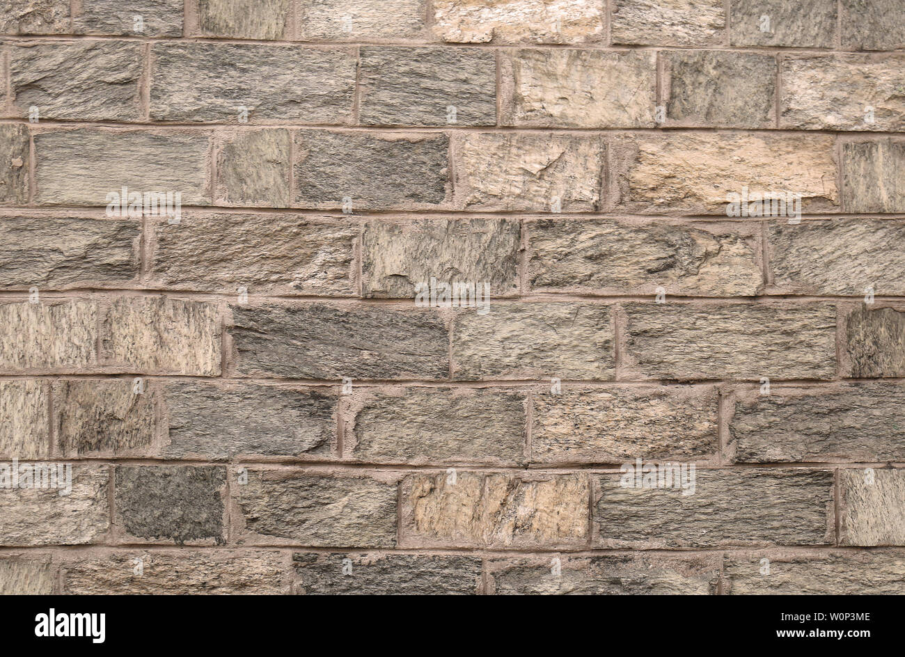 Old beige stone brick pattern background texture Stock Photo - Alamy