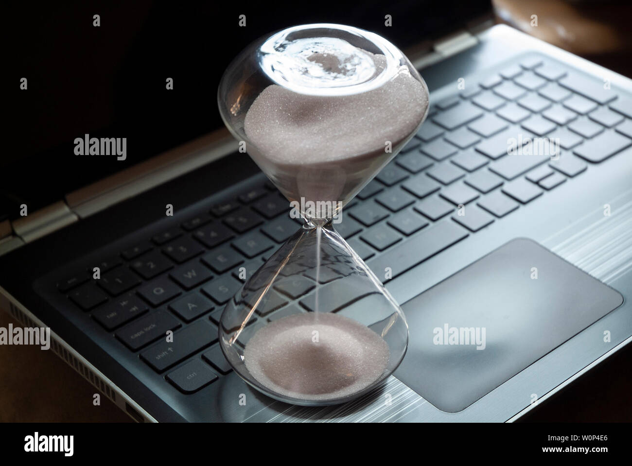 Hourglass laptop hi-res stock photography and images - Alamy