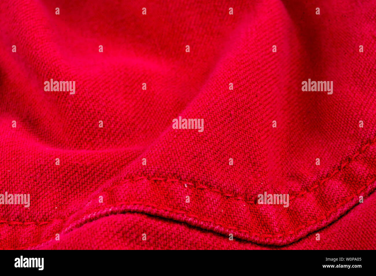 clothing items washed red cotton fabric texture with seams, clasps ...