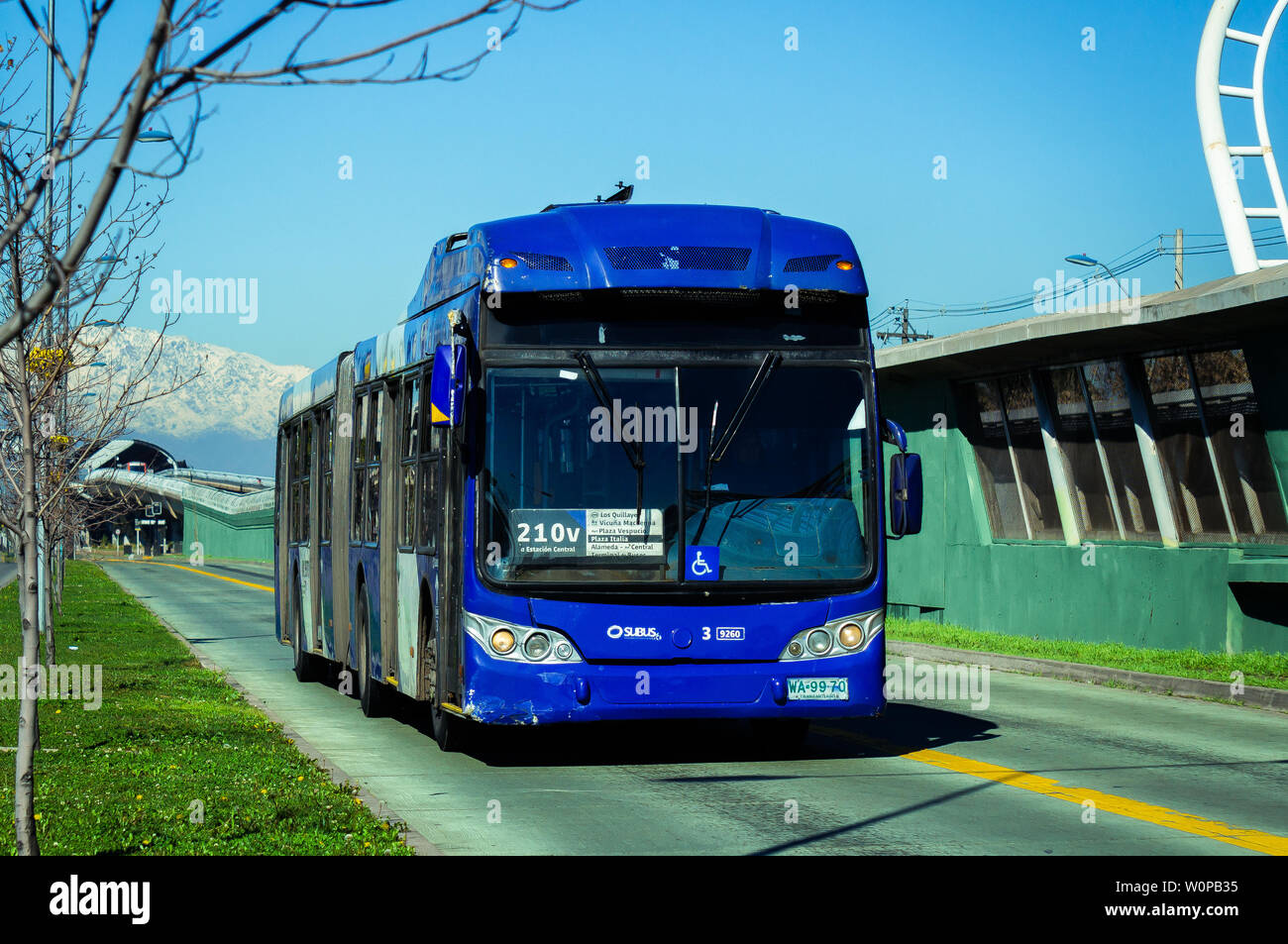 SANTIAGO, CHILE - JULY 2016: An articulated bus on Vicuña Mackenna ...