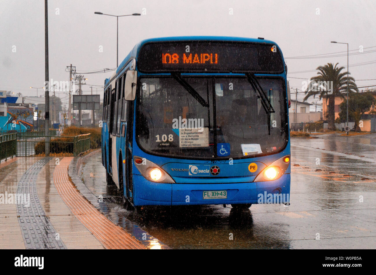 SANTIAGO, CHILE - SEPTEMBER 2017: A Transantiago bus near a bus stop ...