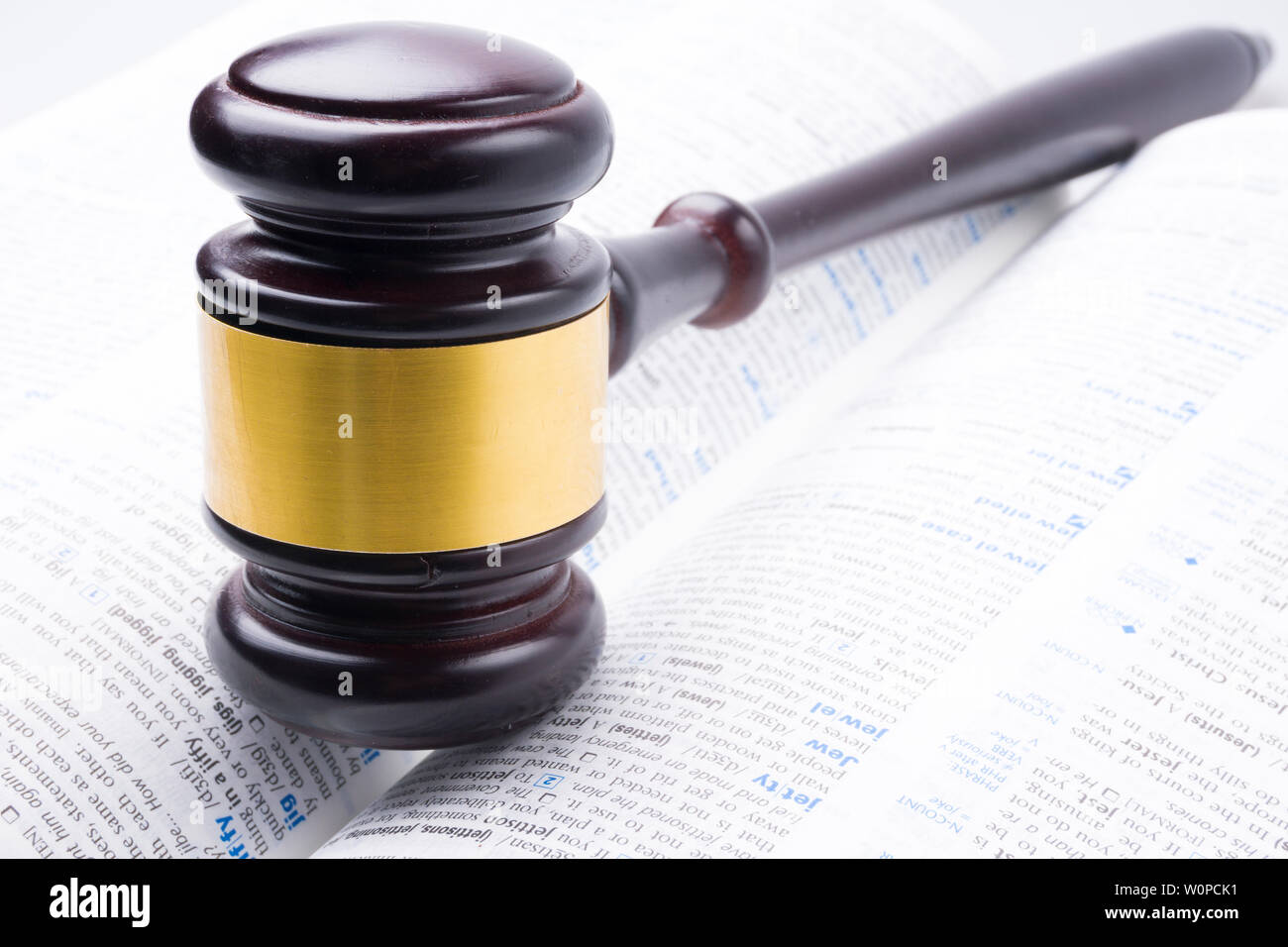 Judge hammer lay on book Stock Photo - Alamy