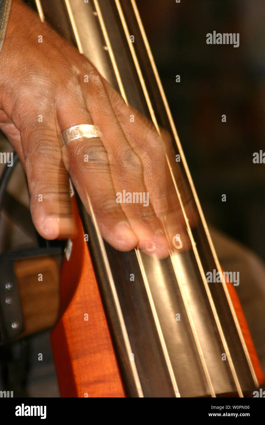 close up of hand playing a double bass Stock Photo - Alamy