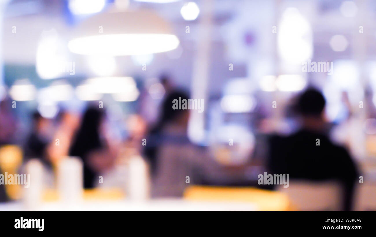 abstract blurred group of asian friends meeting in the restaurant ...