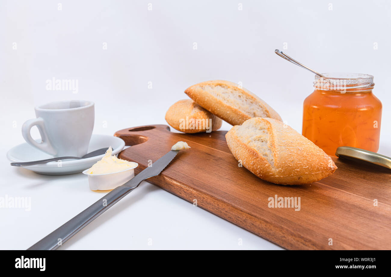 Wooden board with tasty breakfast toasts on white background Stock ...