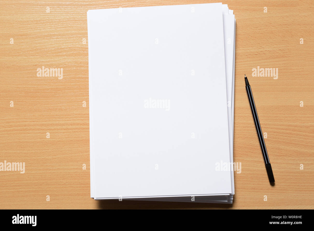 White business card on wooden table. Blank portrait A4 Stock Photo - Alamy