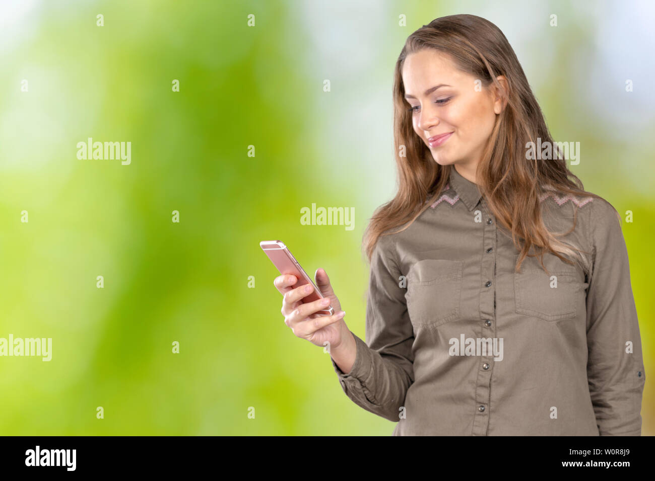 Beautiful young woman with mobile phone Stock Photo - Alamy