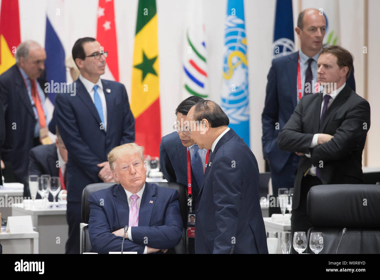 US President Donald Trump (seated) attends first working session of the ...