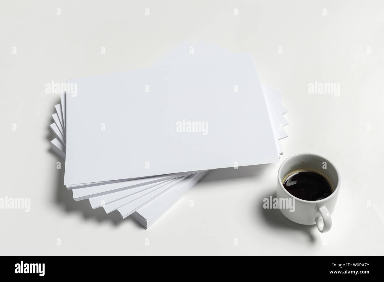 a4 paper and coffee cup Stock Photo - Alamy