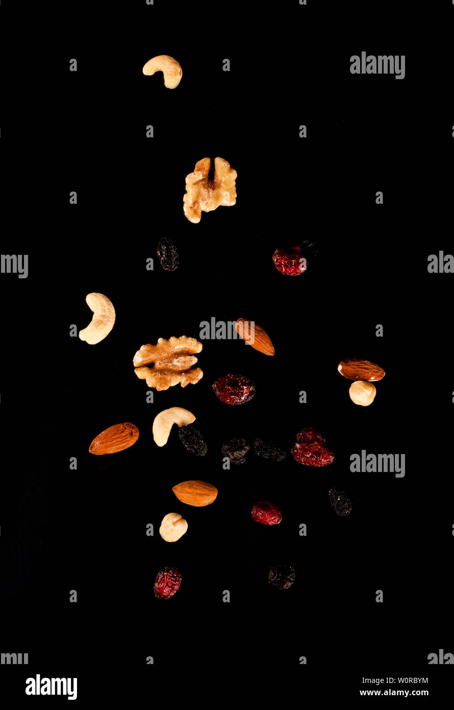 Nuts black background Stock Photo - Alamy