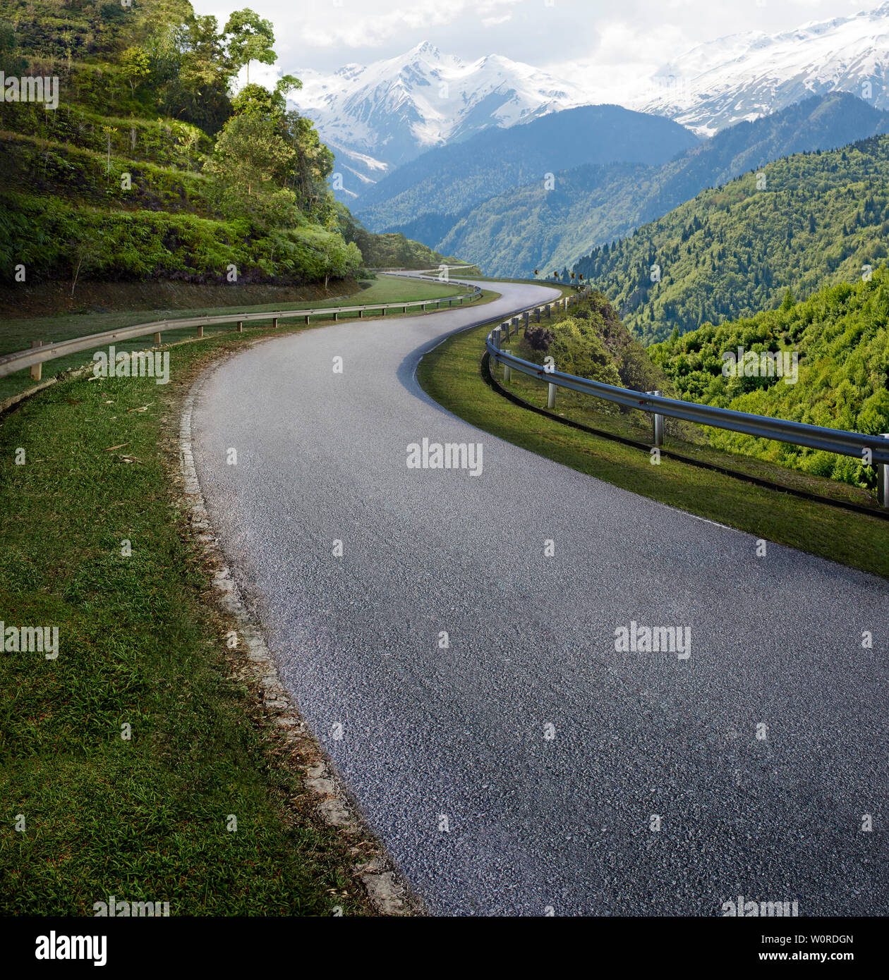 Curved asphalt road in high mountains Stock Photo - Alamy