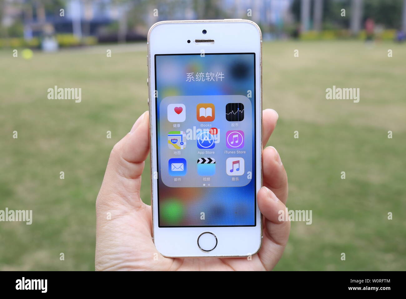 Handheld apple hi-res stock photography and images - Alamy