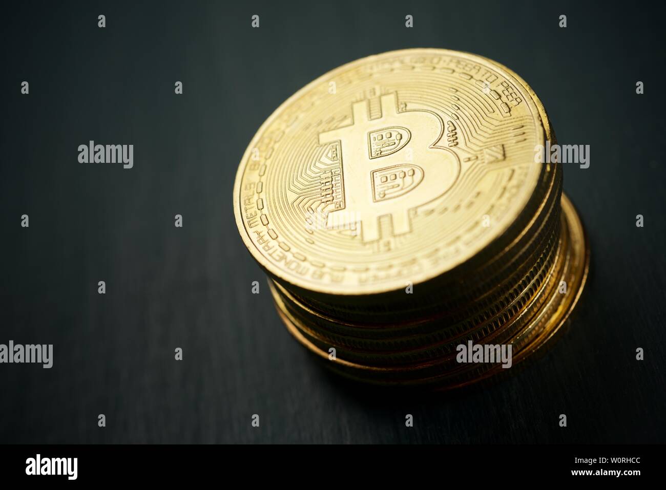 Bitcoins on a wood table Stock Photo - Alamy