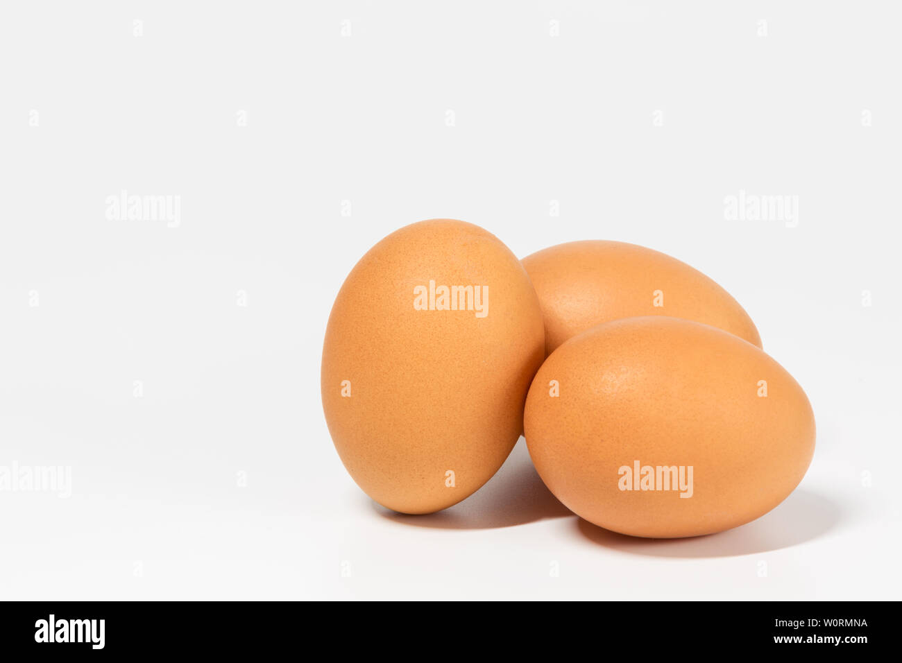 Eggs on white background Stock Photo - Alamy