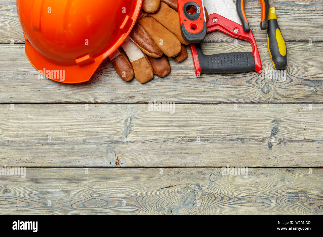 Assorted work tools on wooden table Stock Photo - Alamy