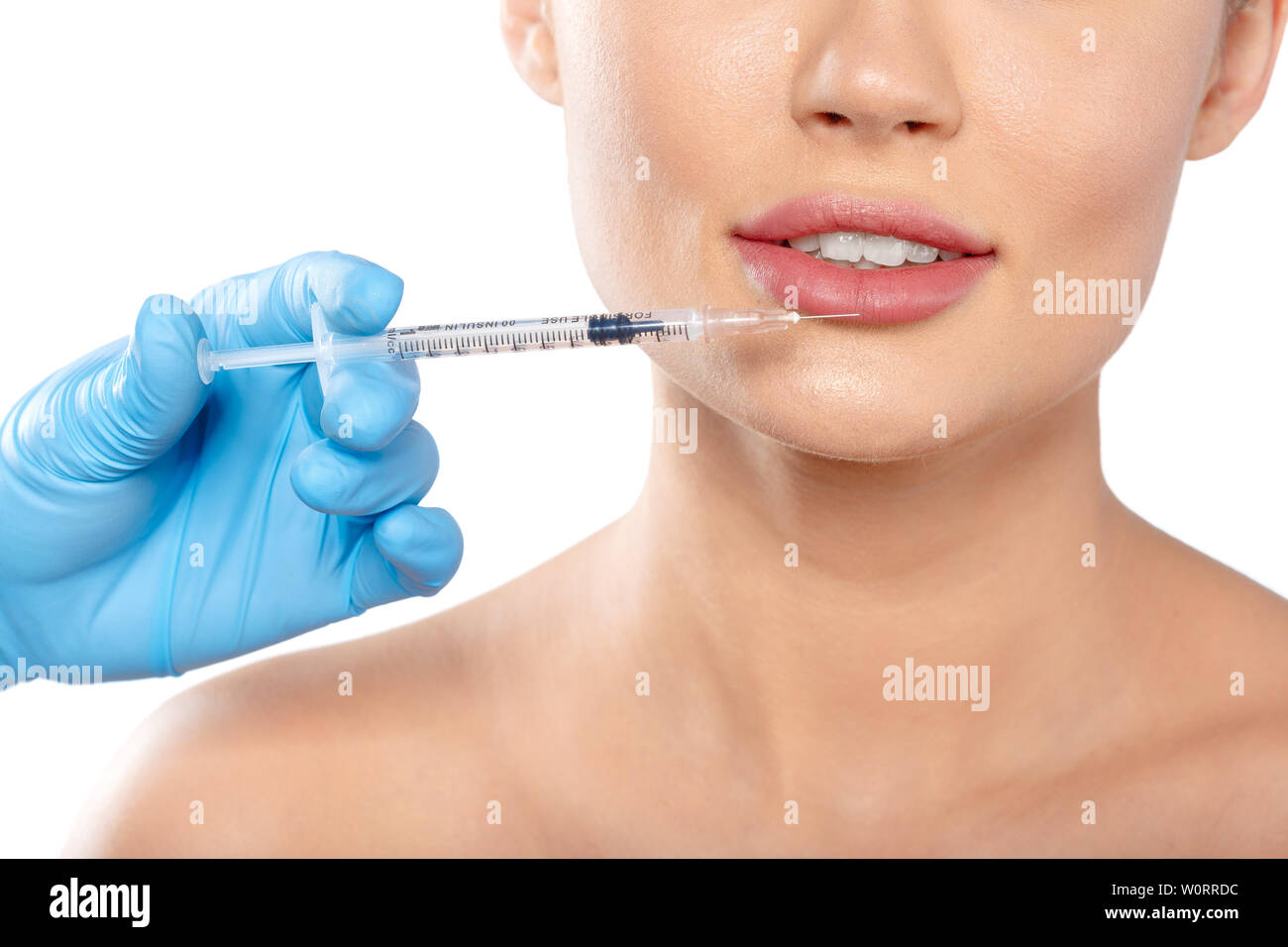 Portrait of an attractive young woman receiving botox treatment Stock ...