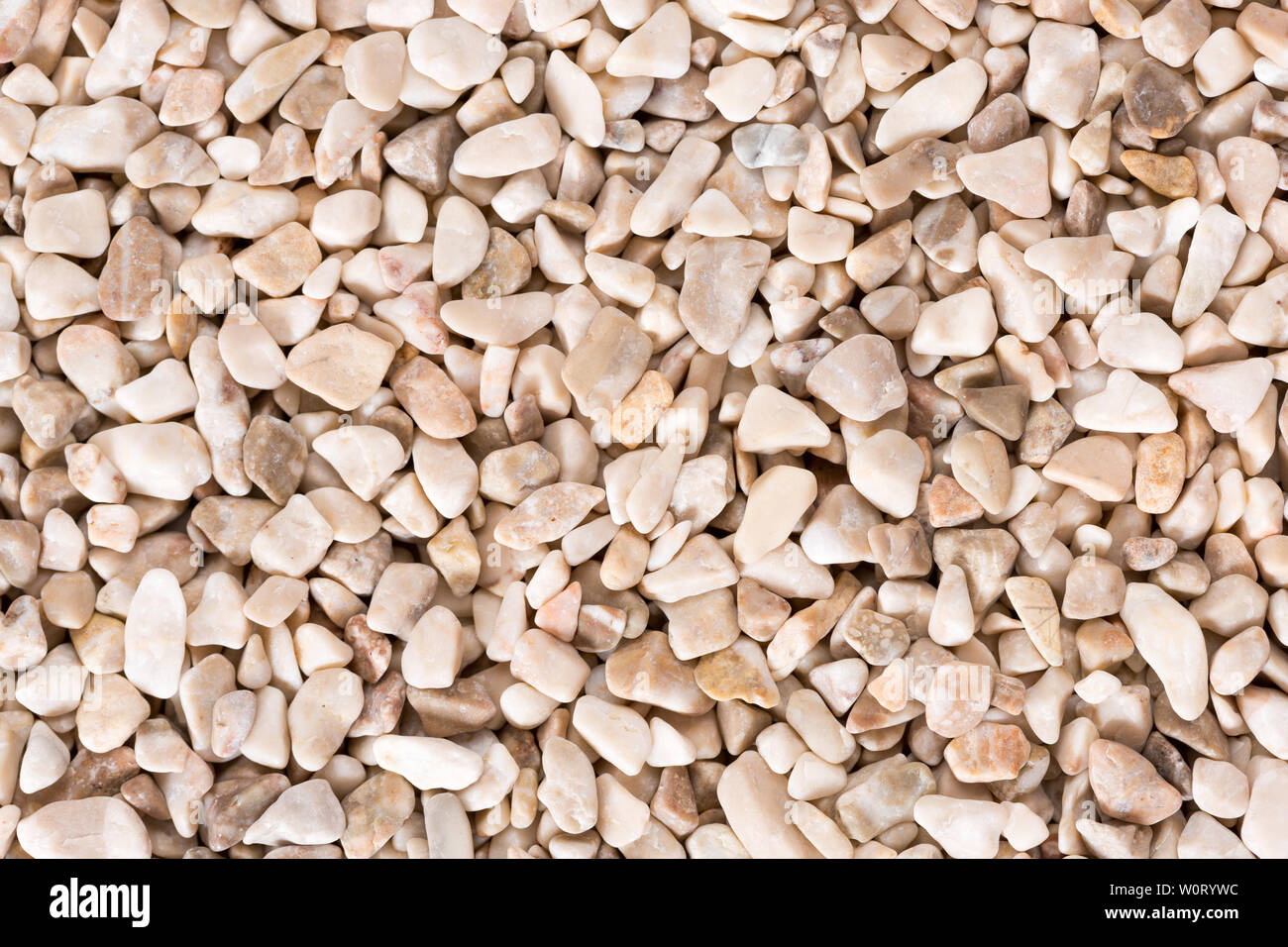Dark beige fine pebbles texture. High resolution photo Stock Photo - Alamy