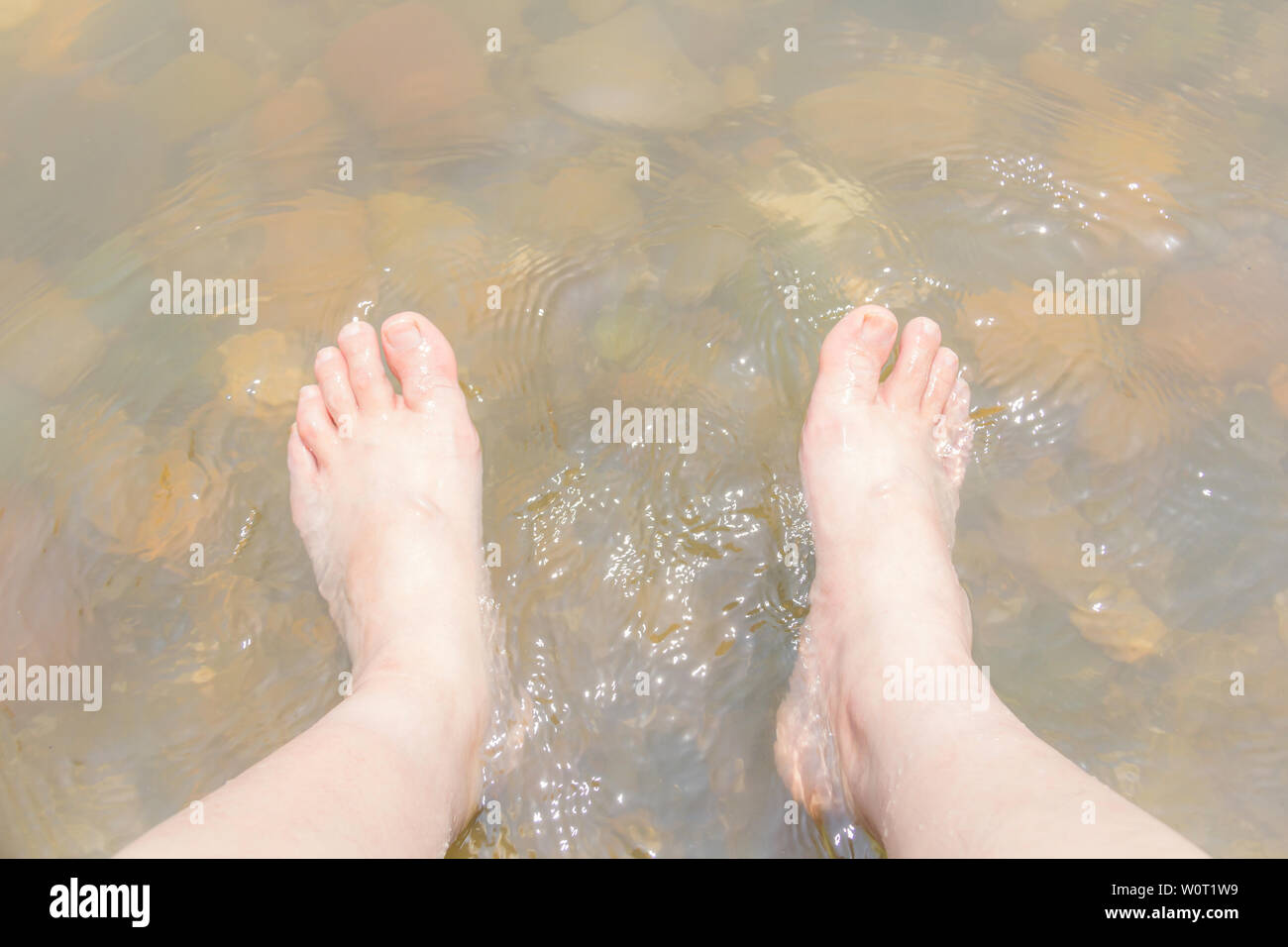 Dipping toes in water hi-res stock photography and images - Alamy